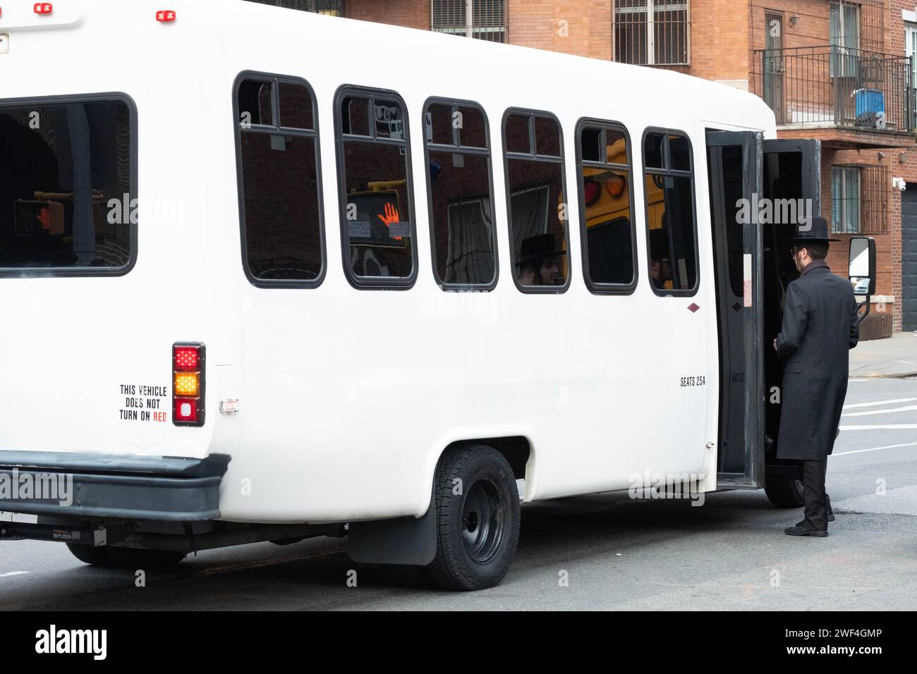 An orthodox Jewish man boards a bus to travel to the other side of ...