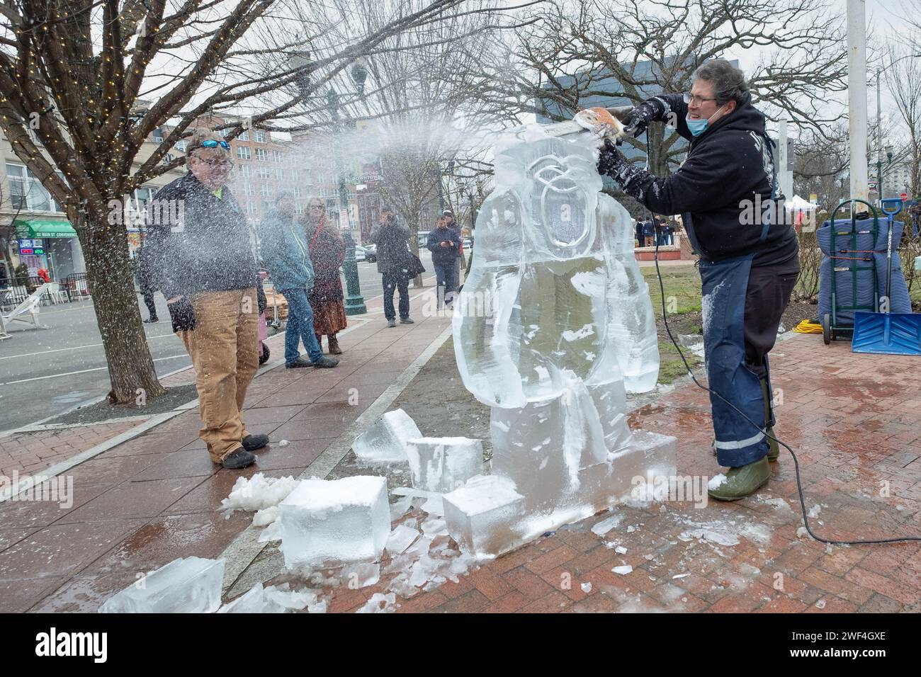 Jimmy Chiappe, ice sculptor, carves a gorilla from blocks of ice using a chain saw. At the Fire ...