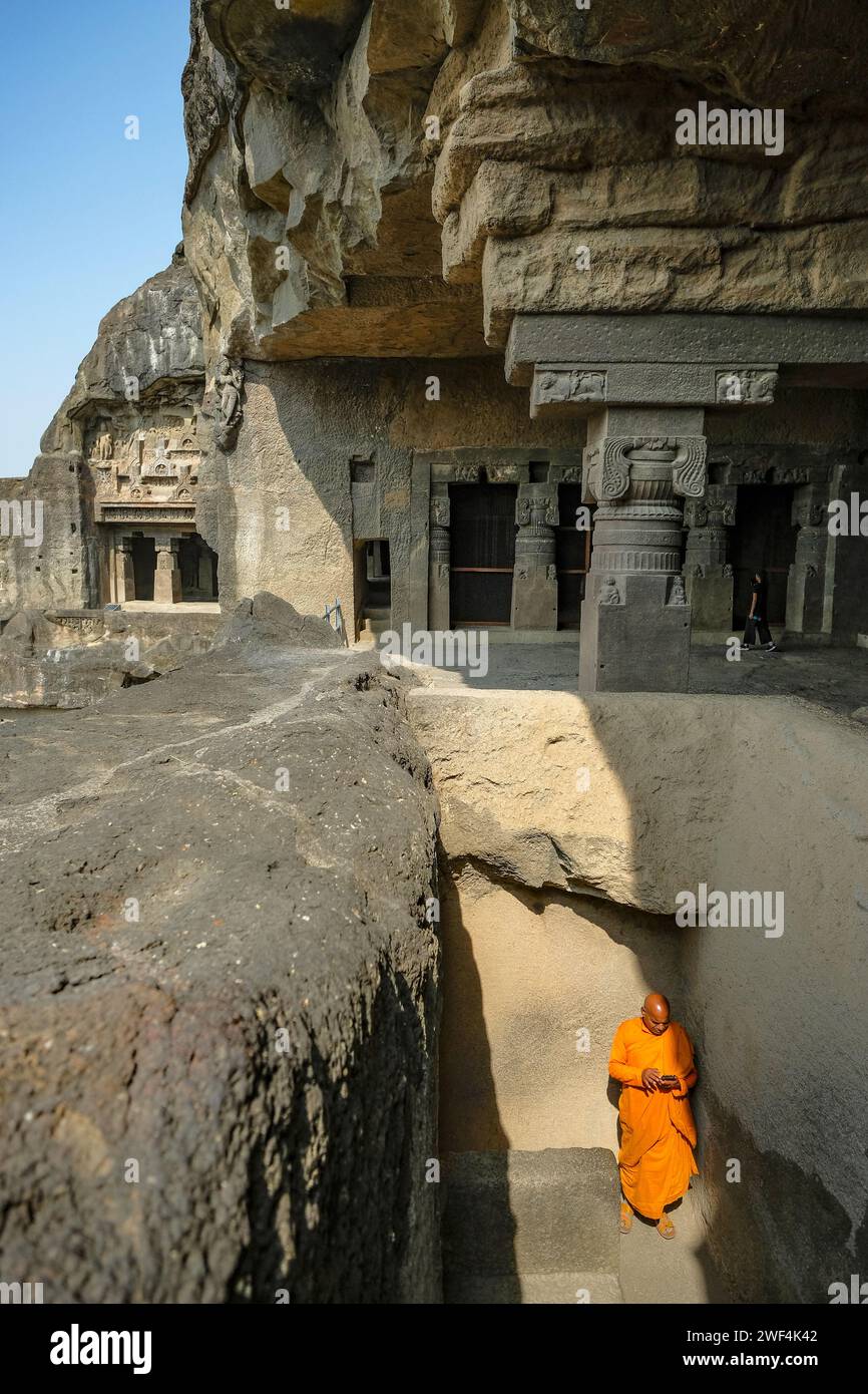 Ellora, India - January 22, 2024: A Buddhist monk visiting the Ellora ...