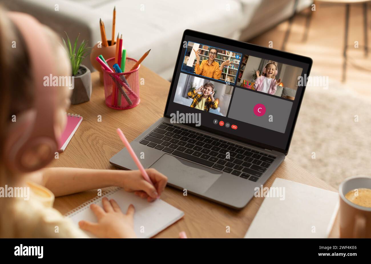 Homeschool girl student in headset learning during virtual online class ...