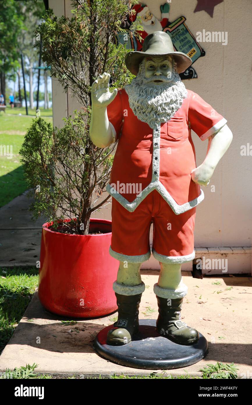 A statue of Father Christmas down under wearing shorts and a bush hat ...