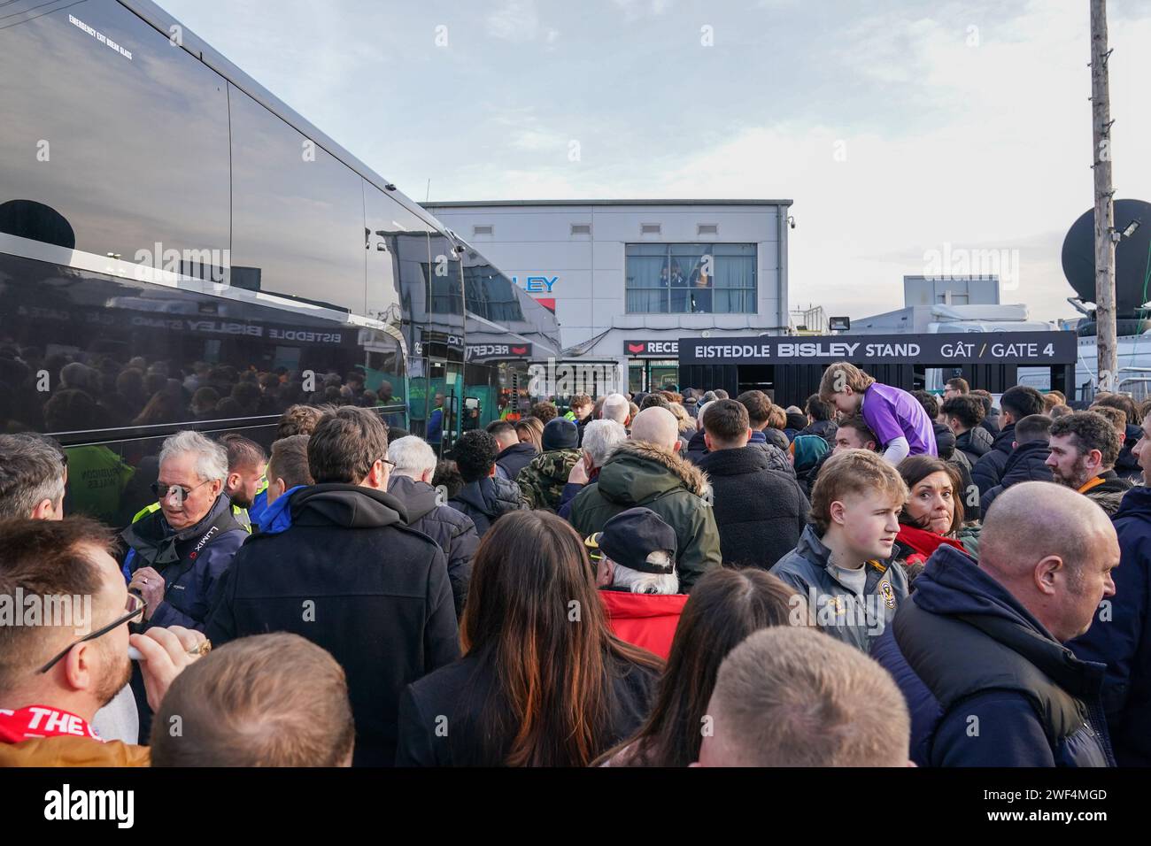 Newport, UK. 28th Jan, 2024. Fans queue for the turnstiles after seeing ...