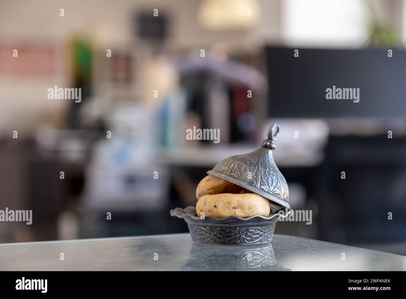 Eid sweets on desk inside working office during ramadan and eid Stock ...