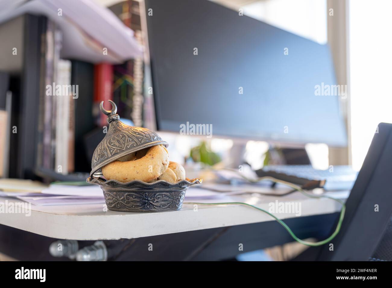 Eid sweets on desk inside working office during ramadan and eid Stock ...