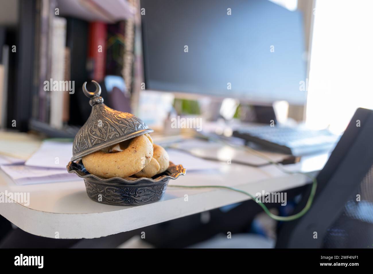 Eid sweets on desk inside working office during ramadan and eid Stock ...