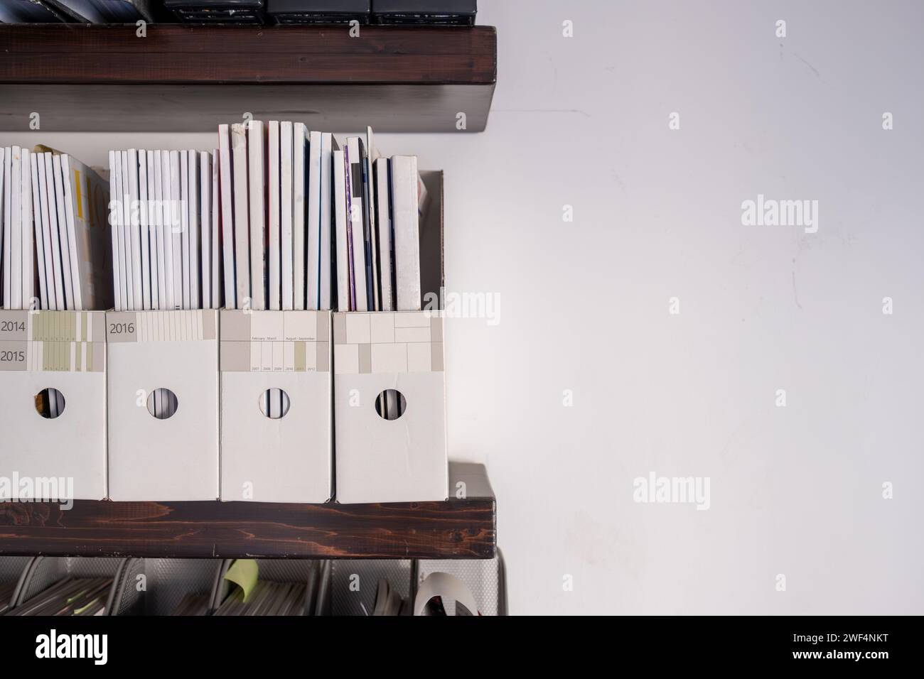 stack of files CD and books on shelf with white background Stock Photo ...