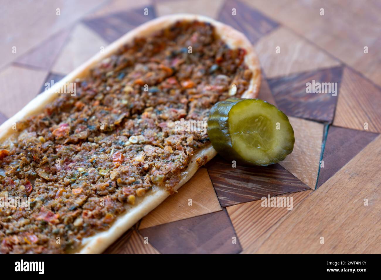Arabic stuffed pastries on arabesque wooden background Stock Photo - Alamy