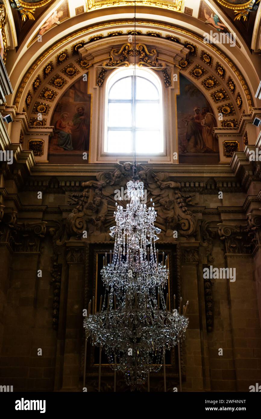 Glass chandelier in the nave of Rabat Cathedral on the island of Gozo ...