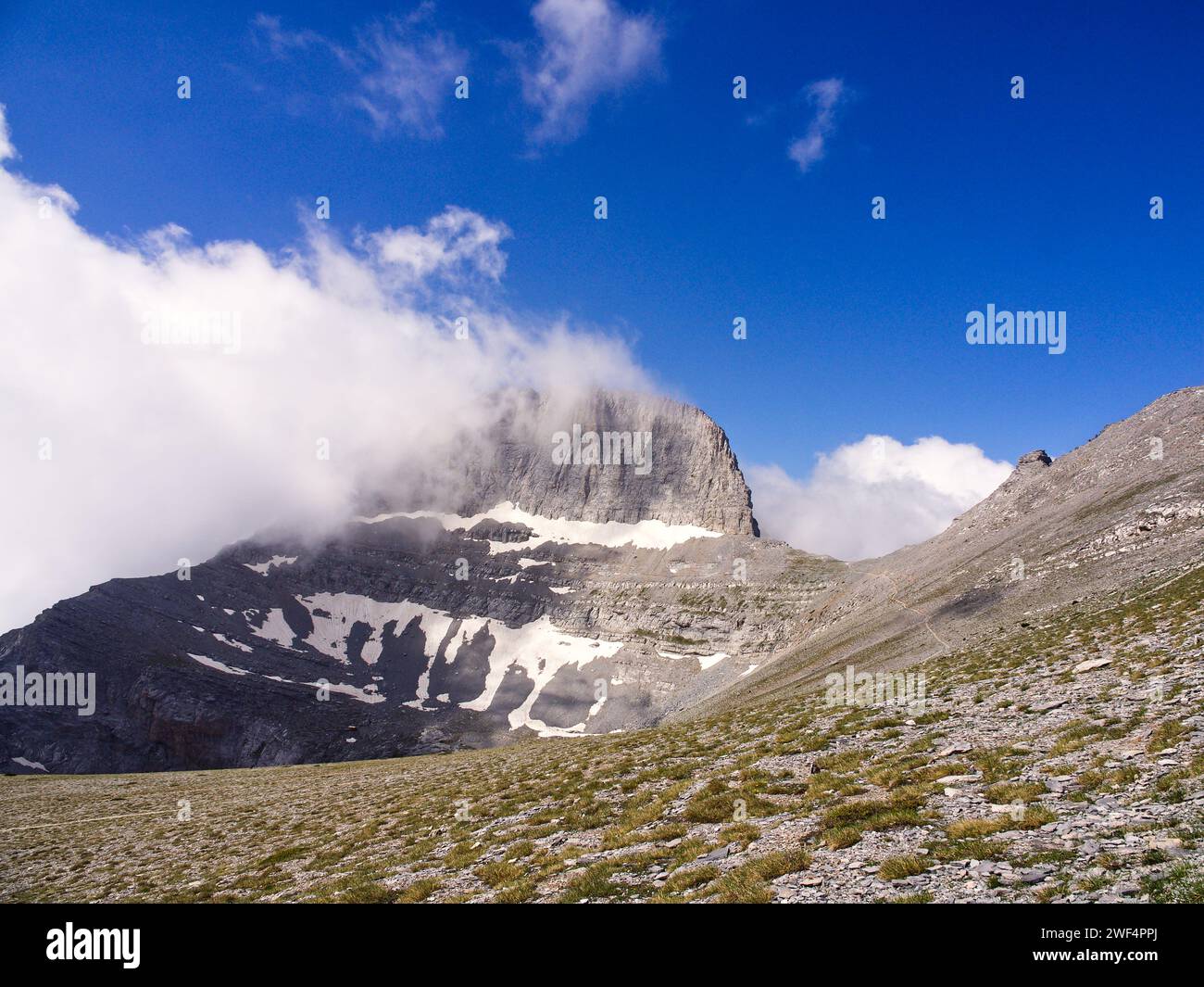 Mountain peak in blue sky and white clouds. Stefani peak also known as ...