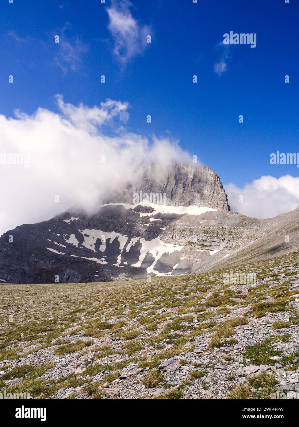 Mountain peak in blue sky and white clouds. Stefani peak also known as ...