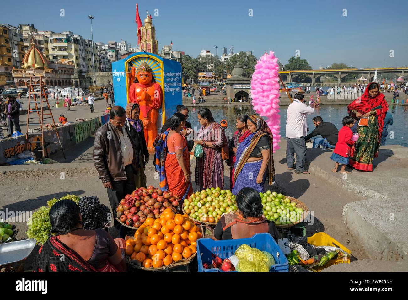 Nashik, India - January 25, 2024: Women selling fruit at the Ganga Ghat ...