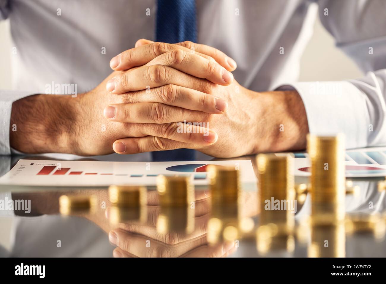 A symbol of profit and saving money. Businesman's hands and growing ...