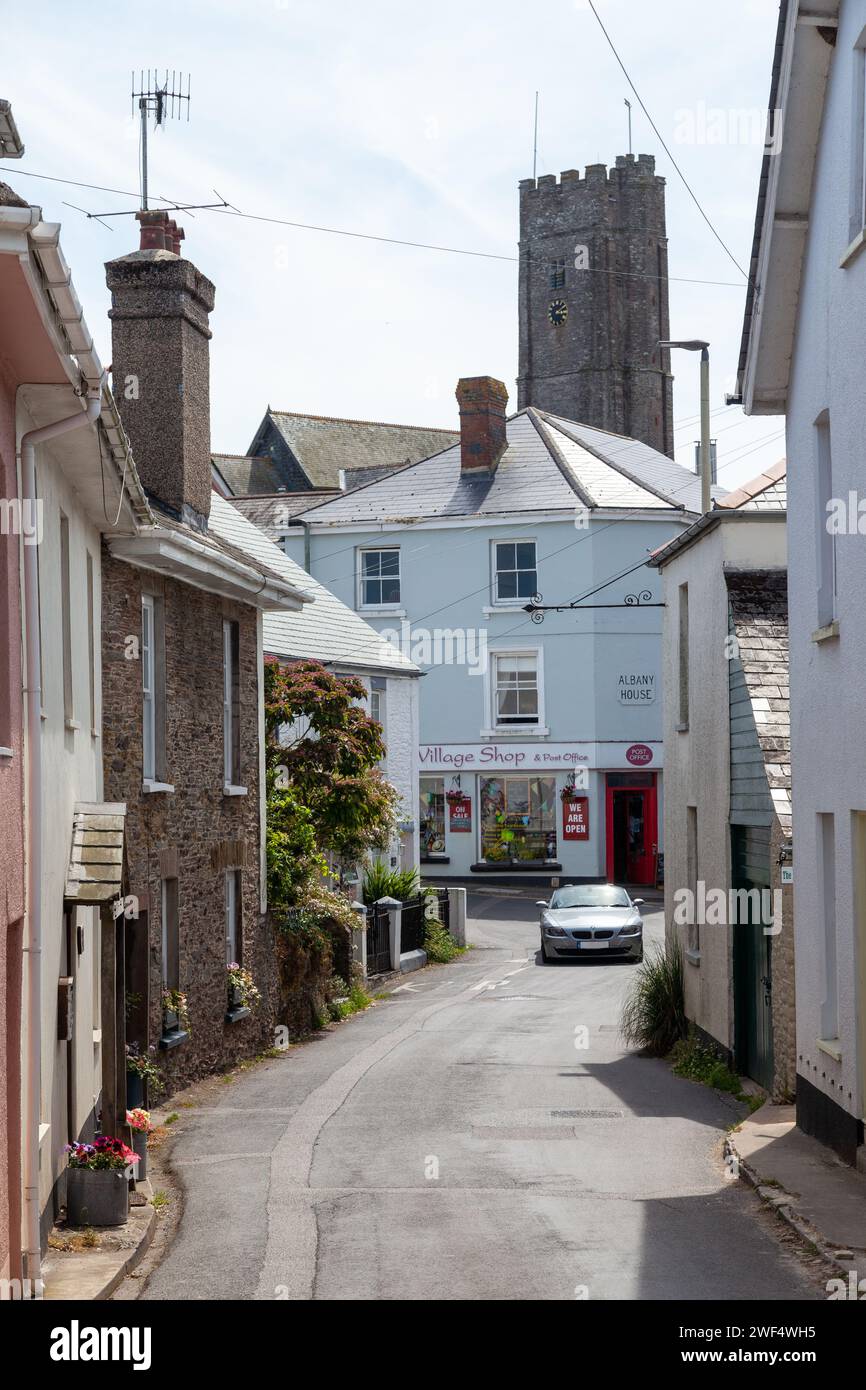 The A379 passing through Stoke Fleming with St Peters Church Tower ...