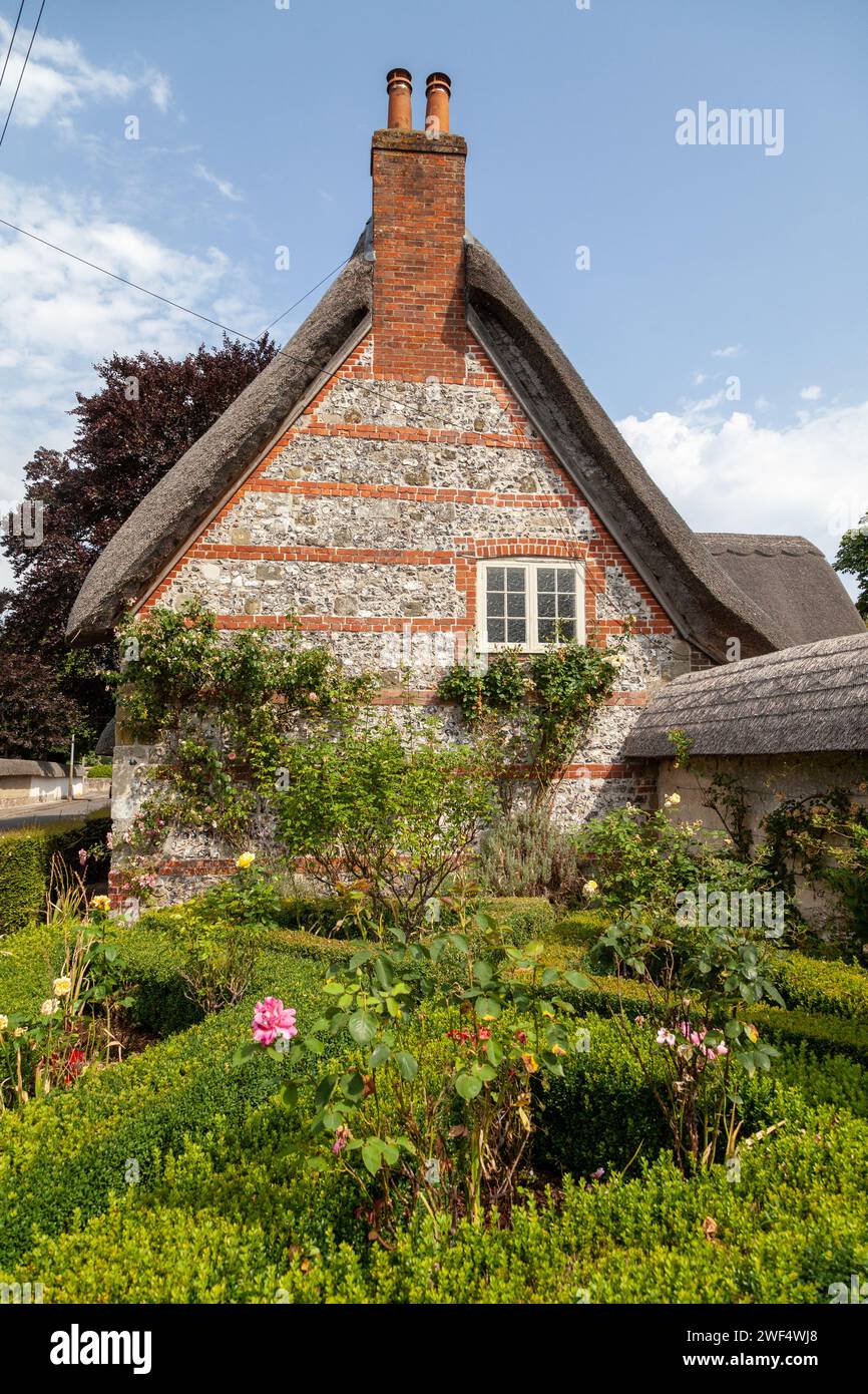 An idyllic flint covered cottage with a thatched roof in Salisbury ...