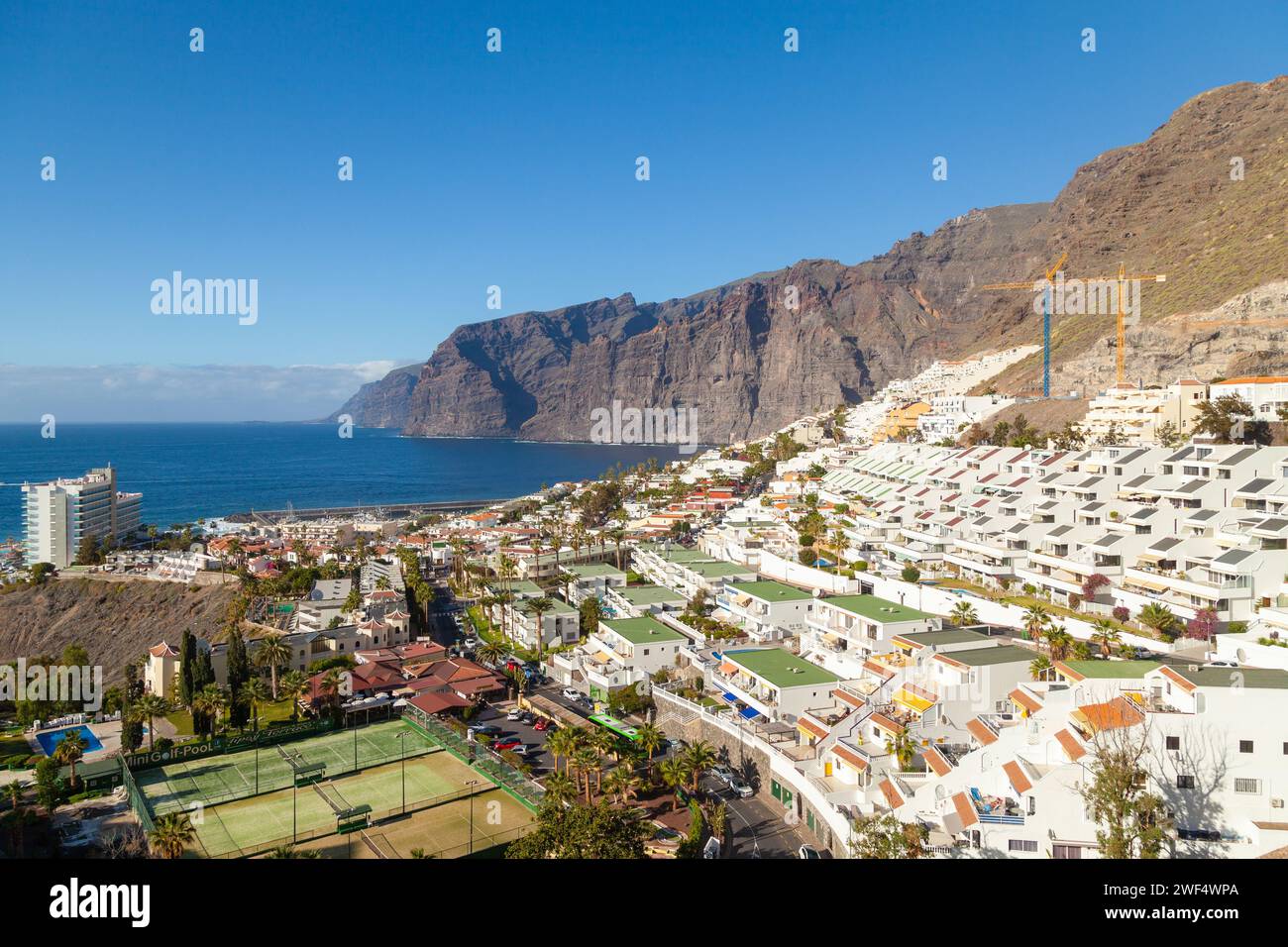 The resort of Los Gigantes with the sheer cliffs behind, Tenerife ...