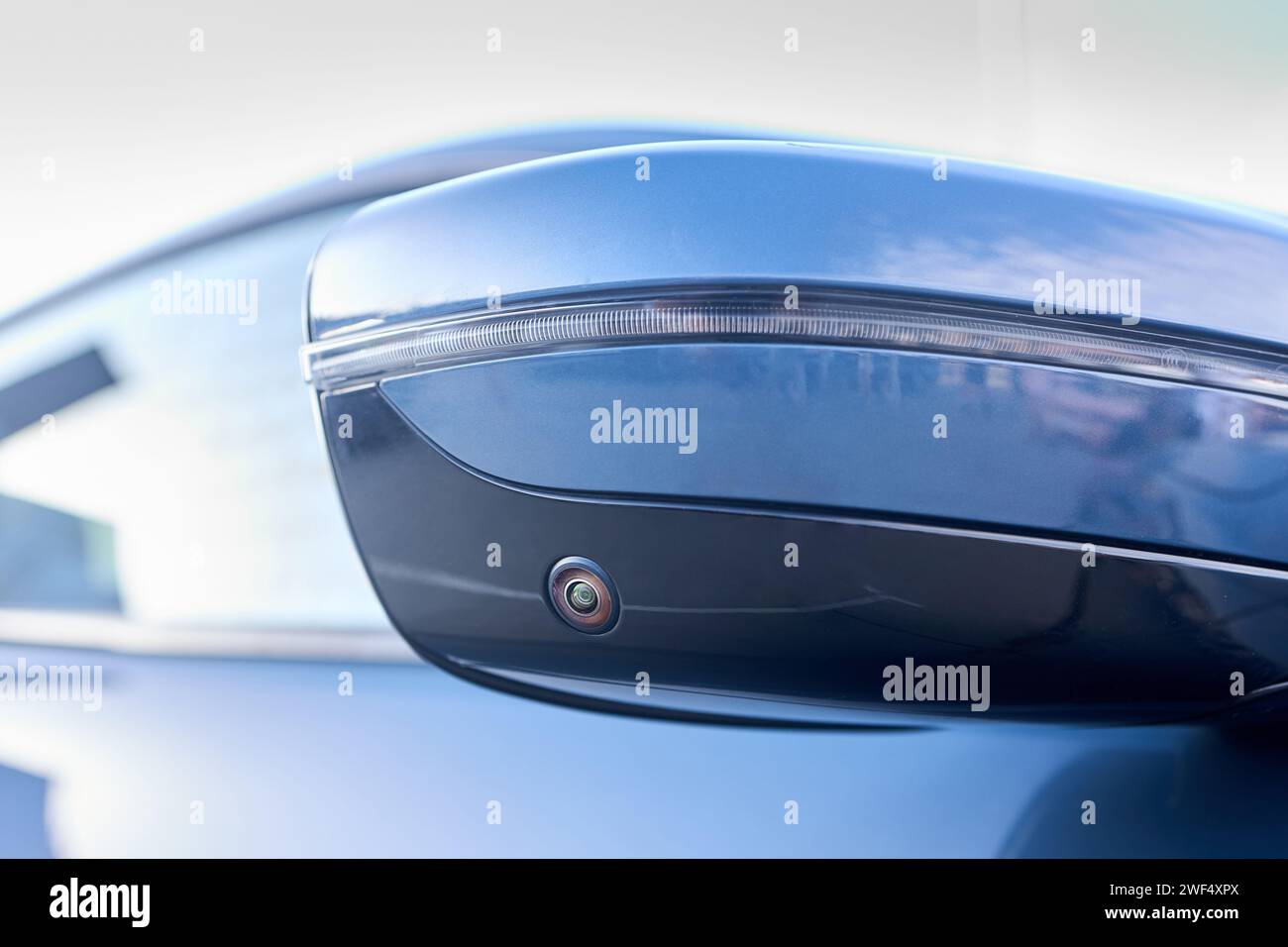 Luxury car detail right back mirror parking camera closeup. Road safety ...