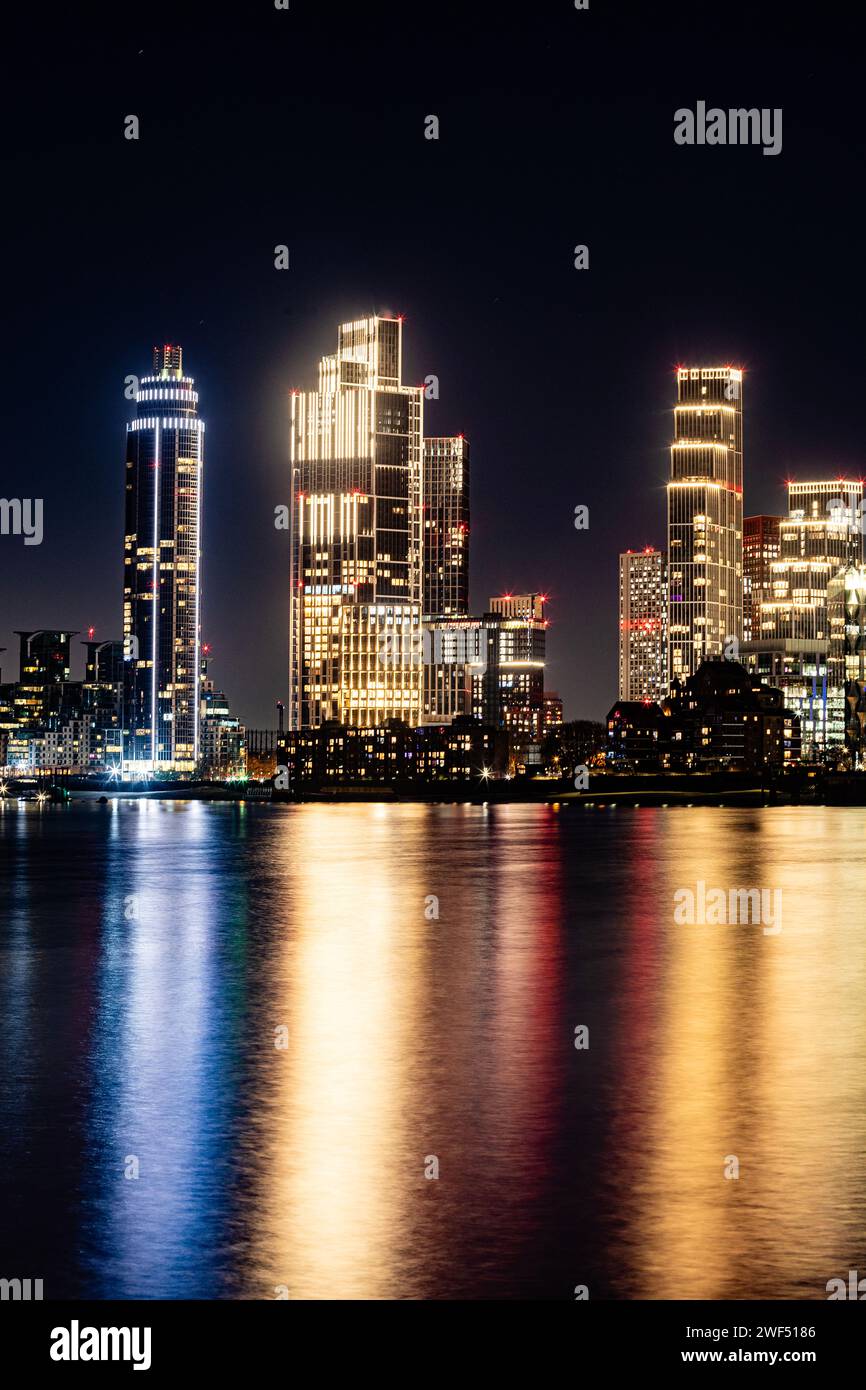 Long exposure nighttime Vauxhall, London skyline reflecting in river ...
