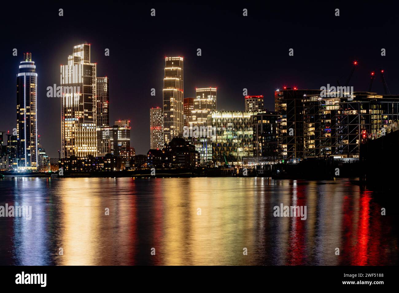 Long exposure nighttime Vauxhall, London skyline reflecting in river ...