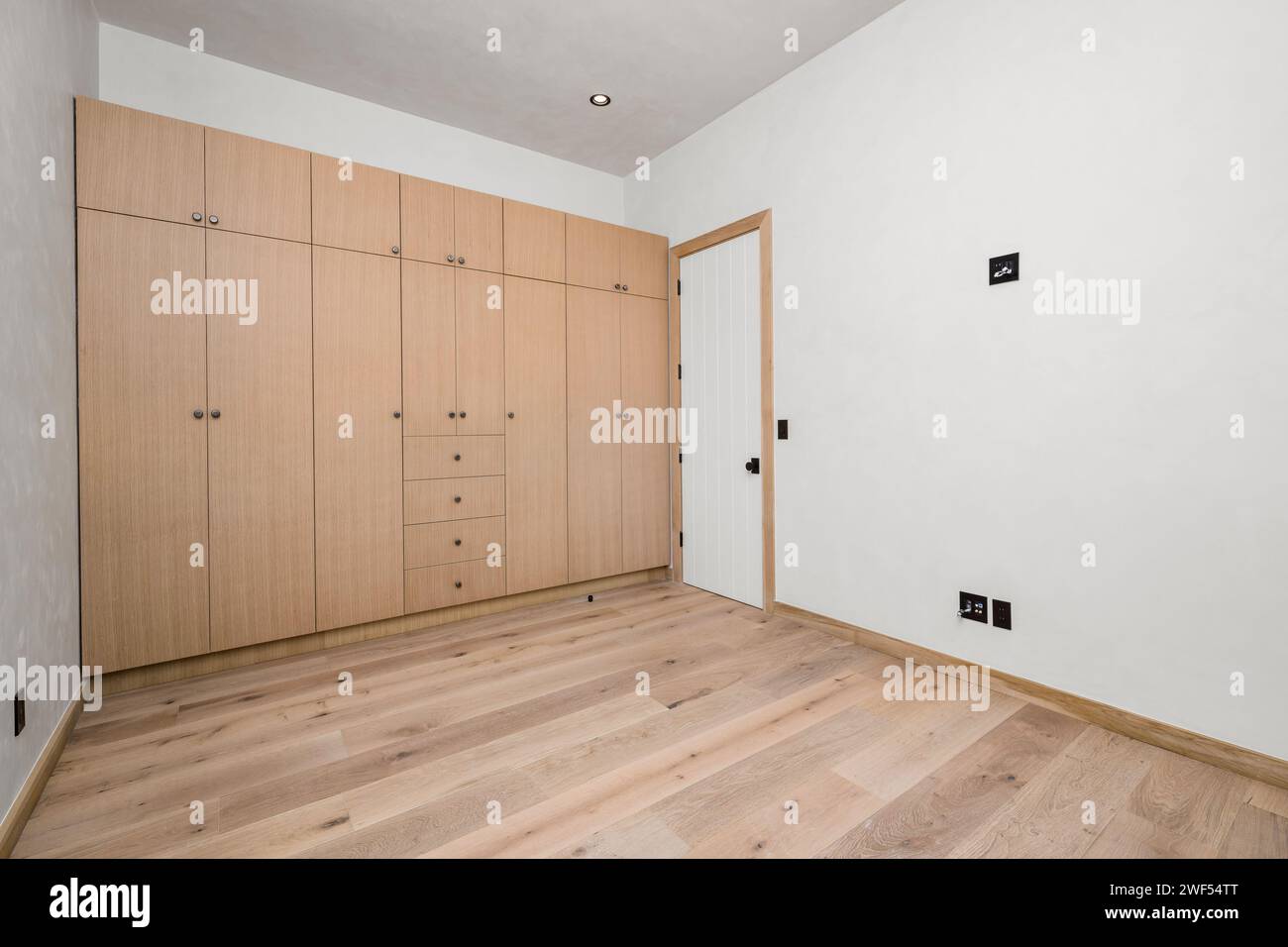 A modern room featuring a secure entrance and storage lockers Stock ...