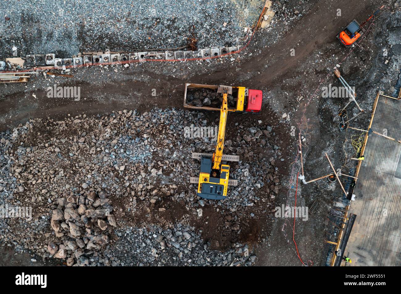Aerial top down view of construction site with excavator and dump ...