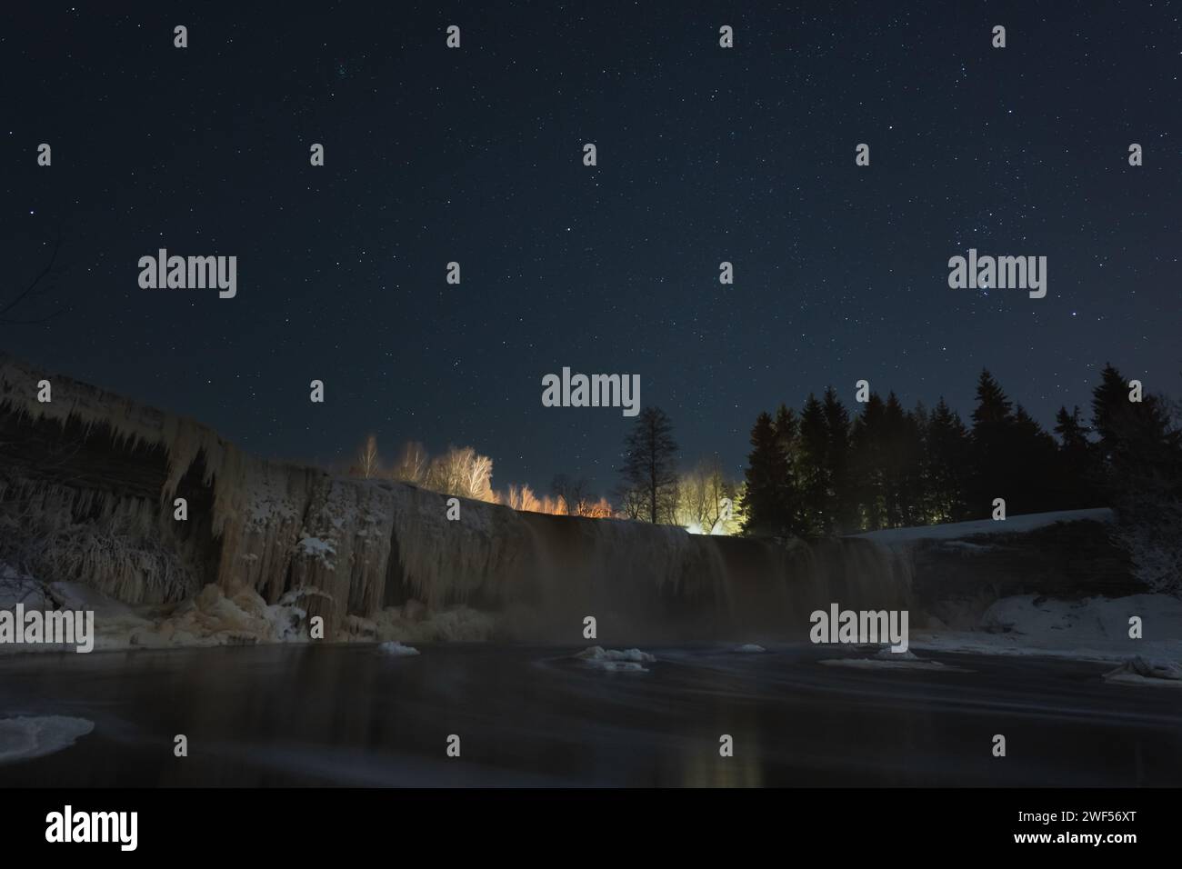 Jagala waterfall at night in winter, photo with weak lighting. Estonian ...