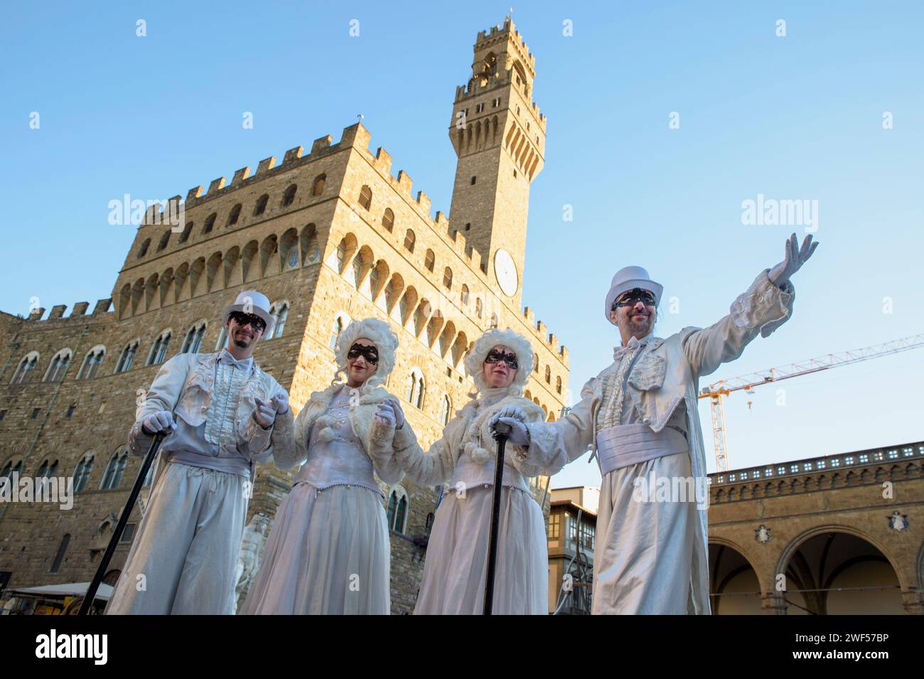 Florence, Italy. 28th Jan, 2024. Masked stilt walkers in front of ...