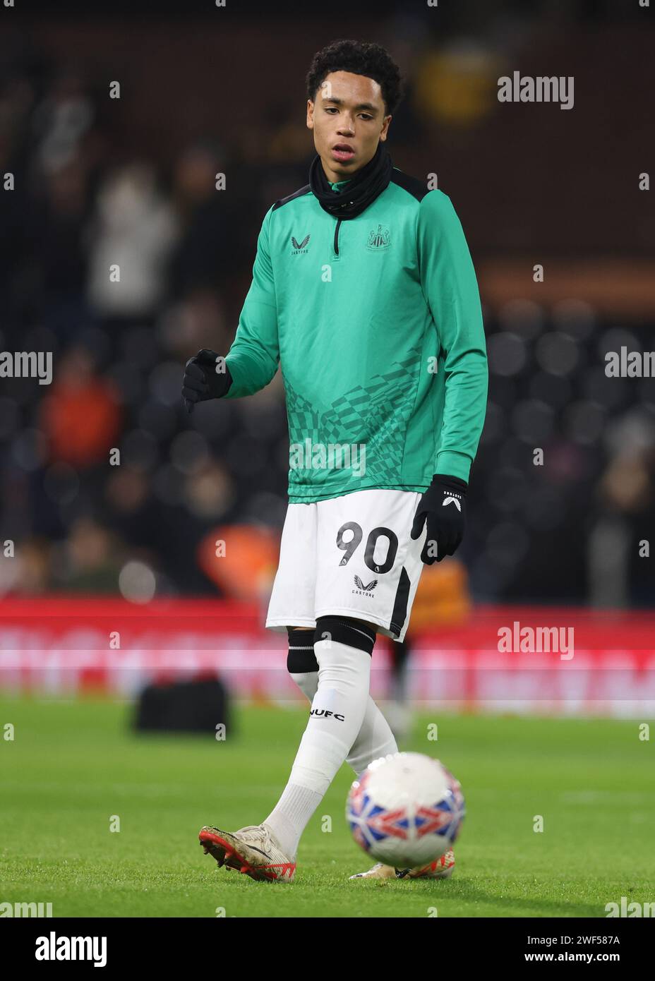 London, UK. 27th Jan, 2024. Travis Hernes of Newcastle United warms up ...