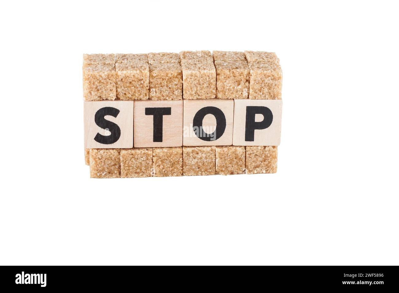 Brown sugar cubes and phrase stop isolated on white background Stock ...