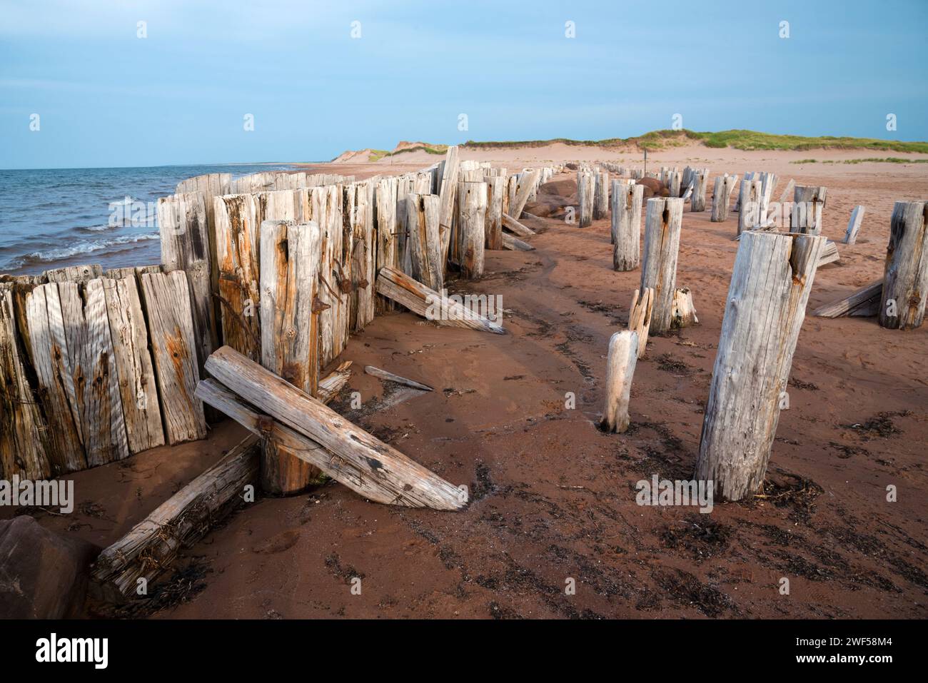 Old and weathered wooden breakwater groynes at Tracadie Bay, Prince ...