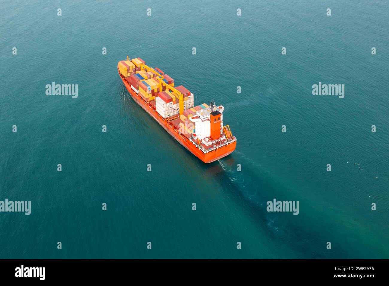 Aerial view of cargo container ship carrying containers for import and ...