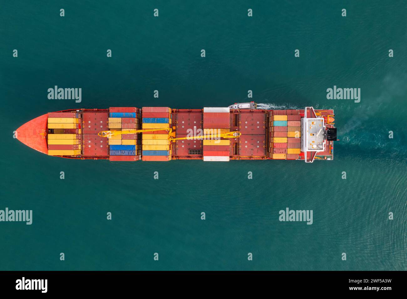Aerial view of cargo container ship carrying containers for import and export, business logistic ...