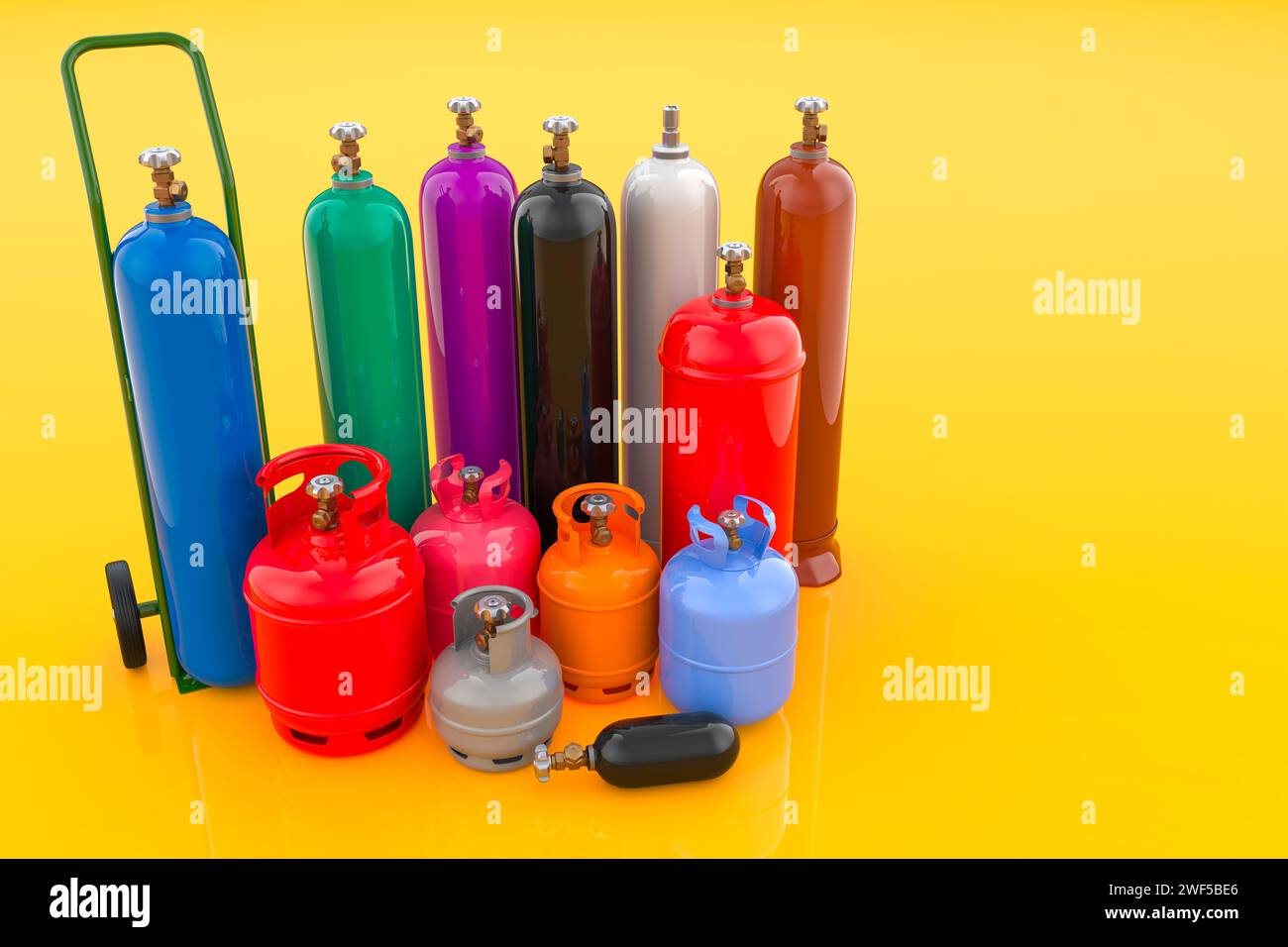 Different industrial liquefied gas cylinders with hand truck on yellow ...