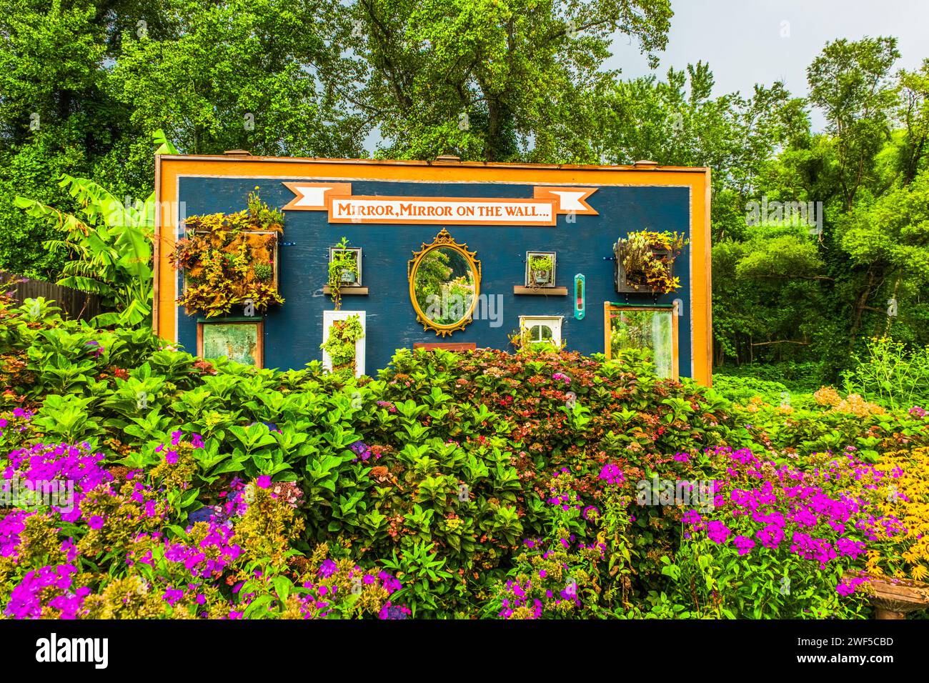 Colorful flowers abound at wall exhibit at Flowering Bridge Garden ...