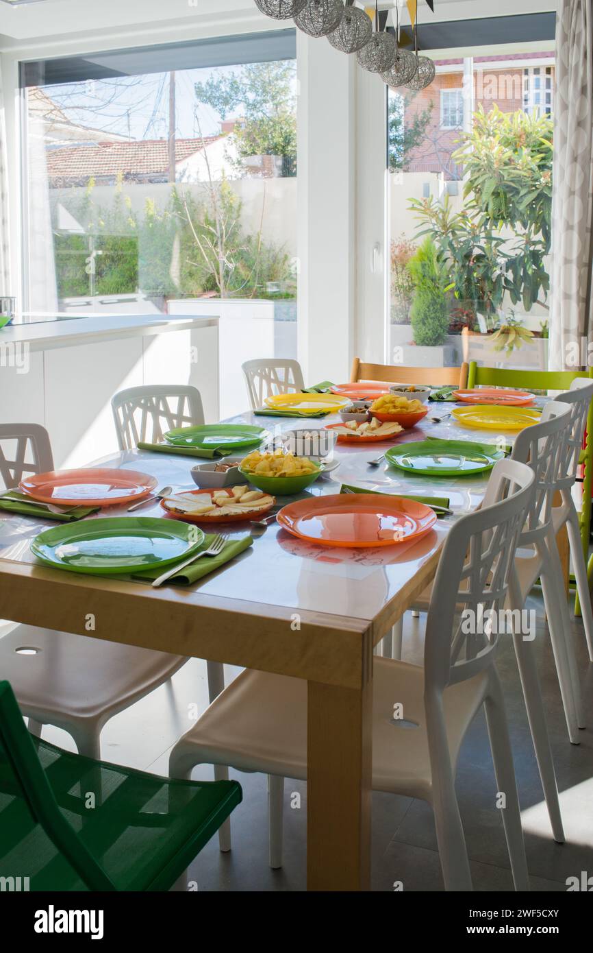 Colorful large family table. Green and orange pattern Stock Photo - Alamy