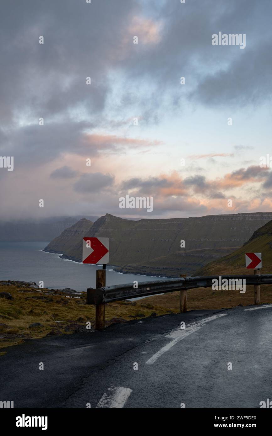 A scenic mountain road winds through breathtaking terrain Stock Photo ...
