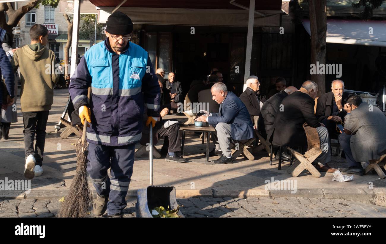 A janitor in a uniform in a historic old town, central Urfa, Sanliurfa ...