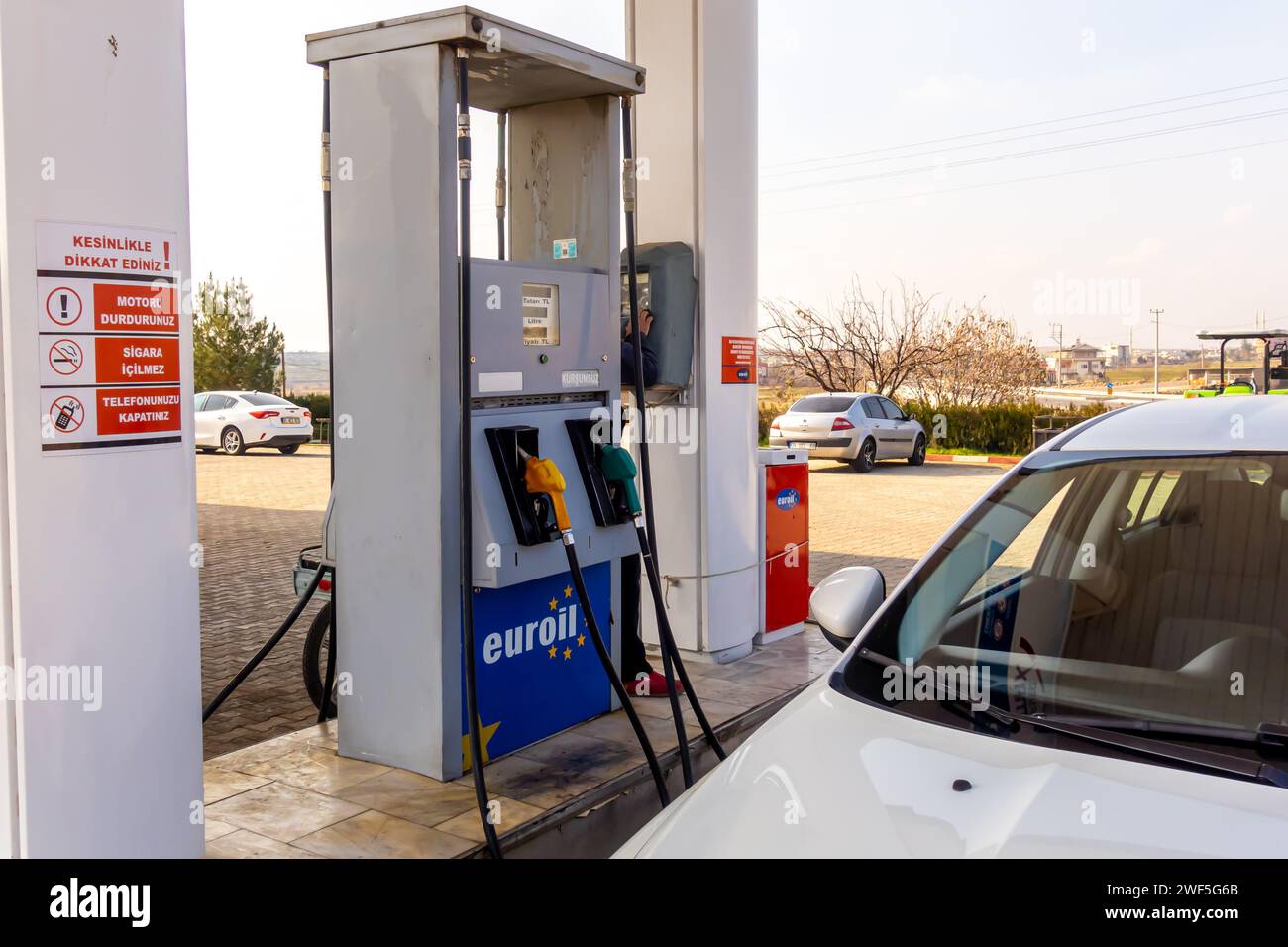 Fuel dispensing equipment at Eurooil gas station and prohibition signs ...