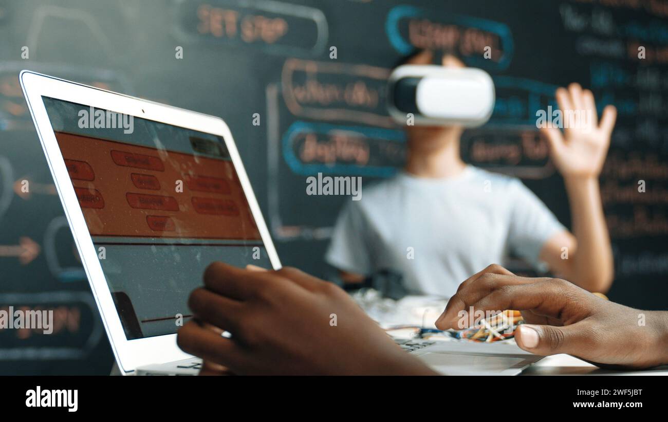 Closeup of african student hands coding or programing system at ...