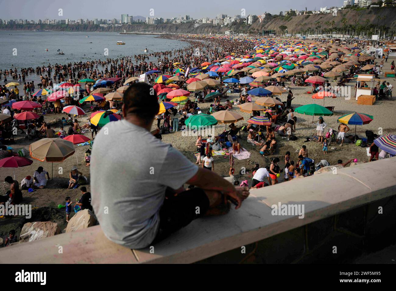 Beachgoers crowd the Agua Dulce beach during summer in Lima, Peru ...