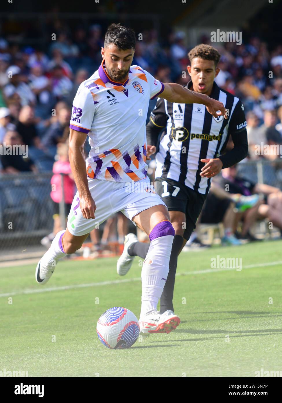 Leumeah, Australia. 28th Jan, 2024. John Koutroumbis (L) of Perth Glory ...