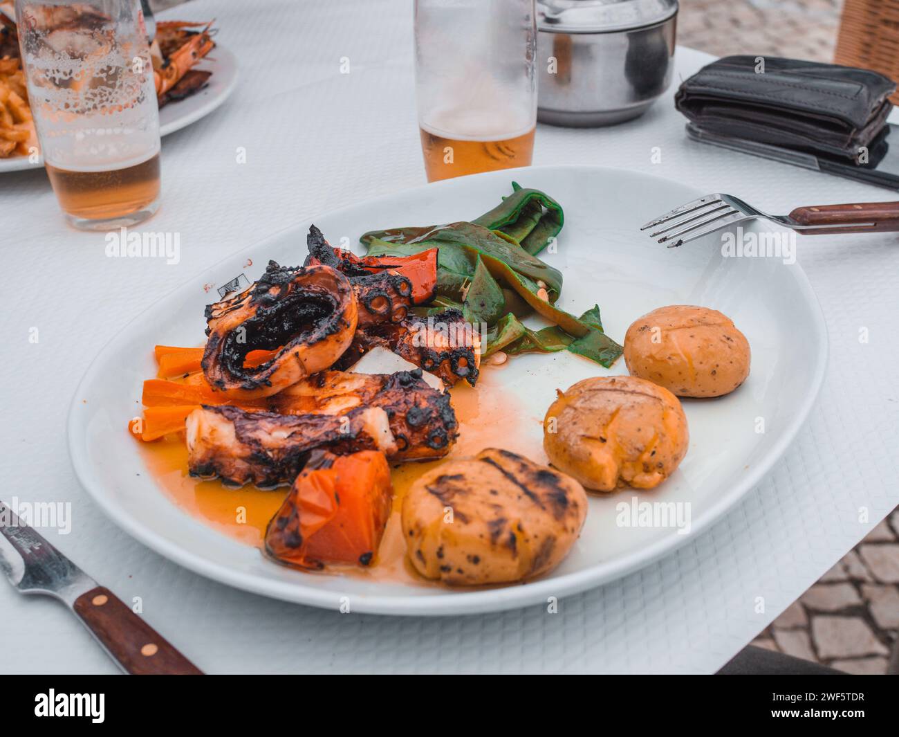Traditional Portuguese food Polvo a Lagareiro in a restaurant Stock ...