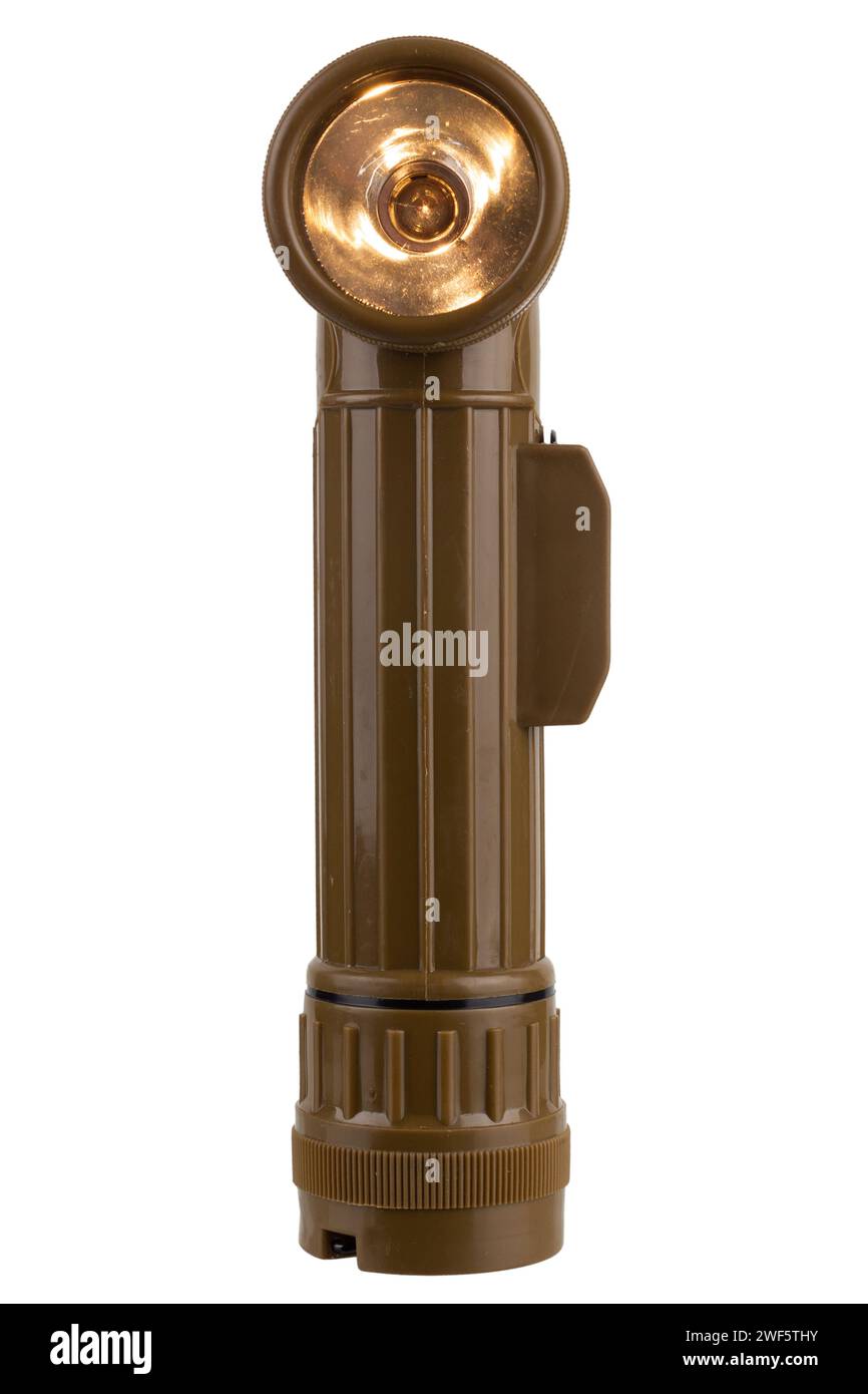 vintage military style flashlight with yellow light isolated on white ...