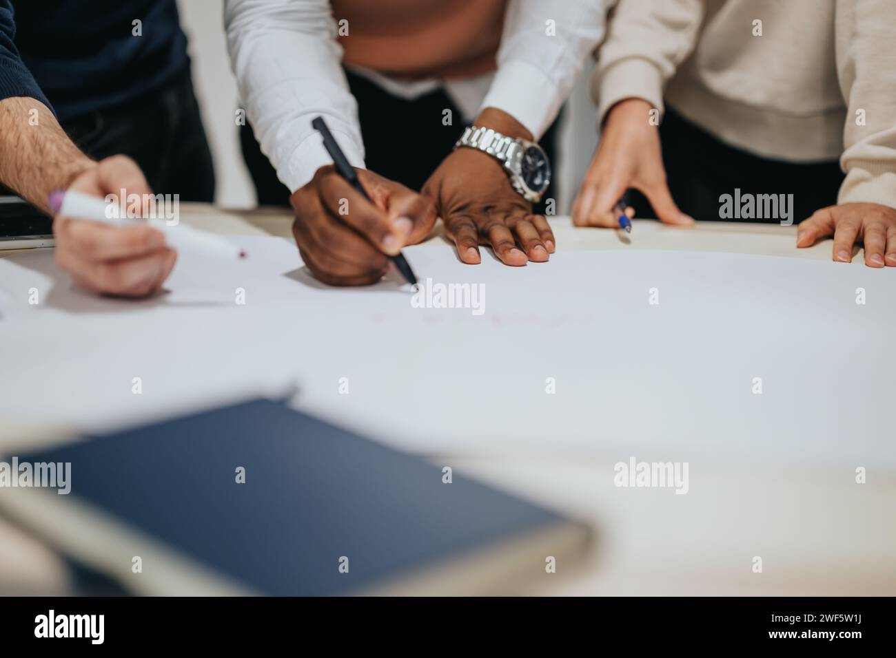 Creative People Analyzing Reports for Business Growth Stock Photo - Alamy