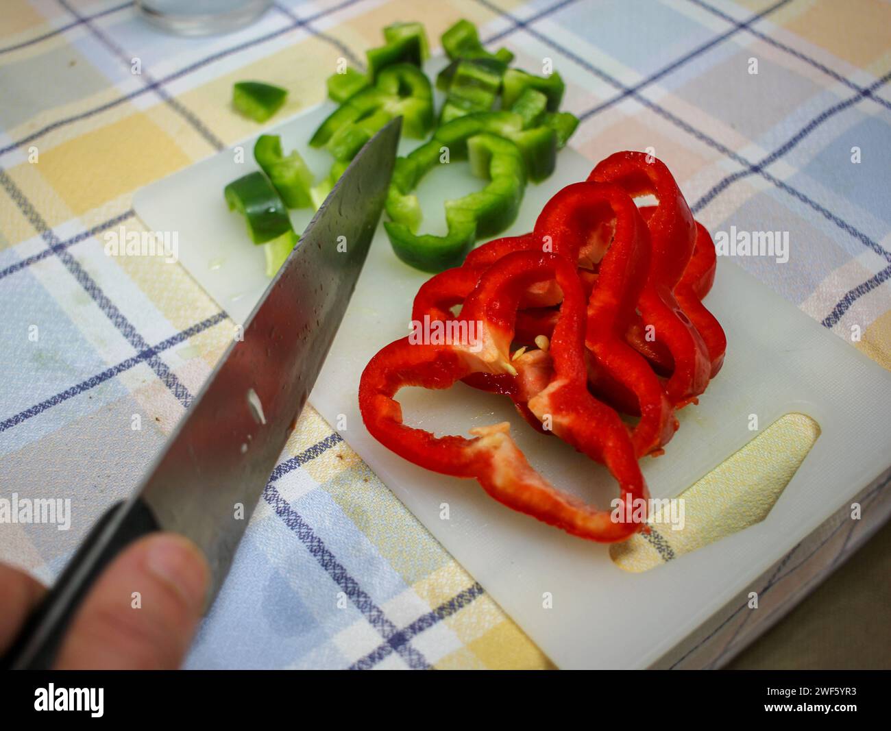 delicious red and green peppers to cook Stock Photo - Alamy