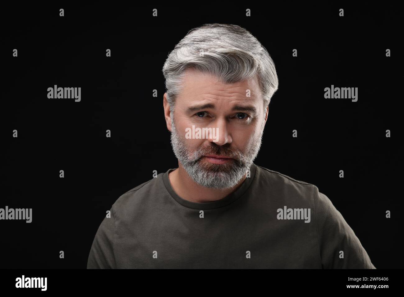 Personality concept. Portrait of emotional man on black background ...