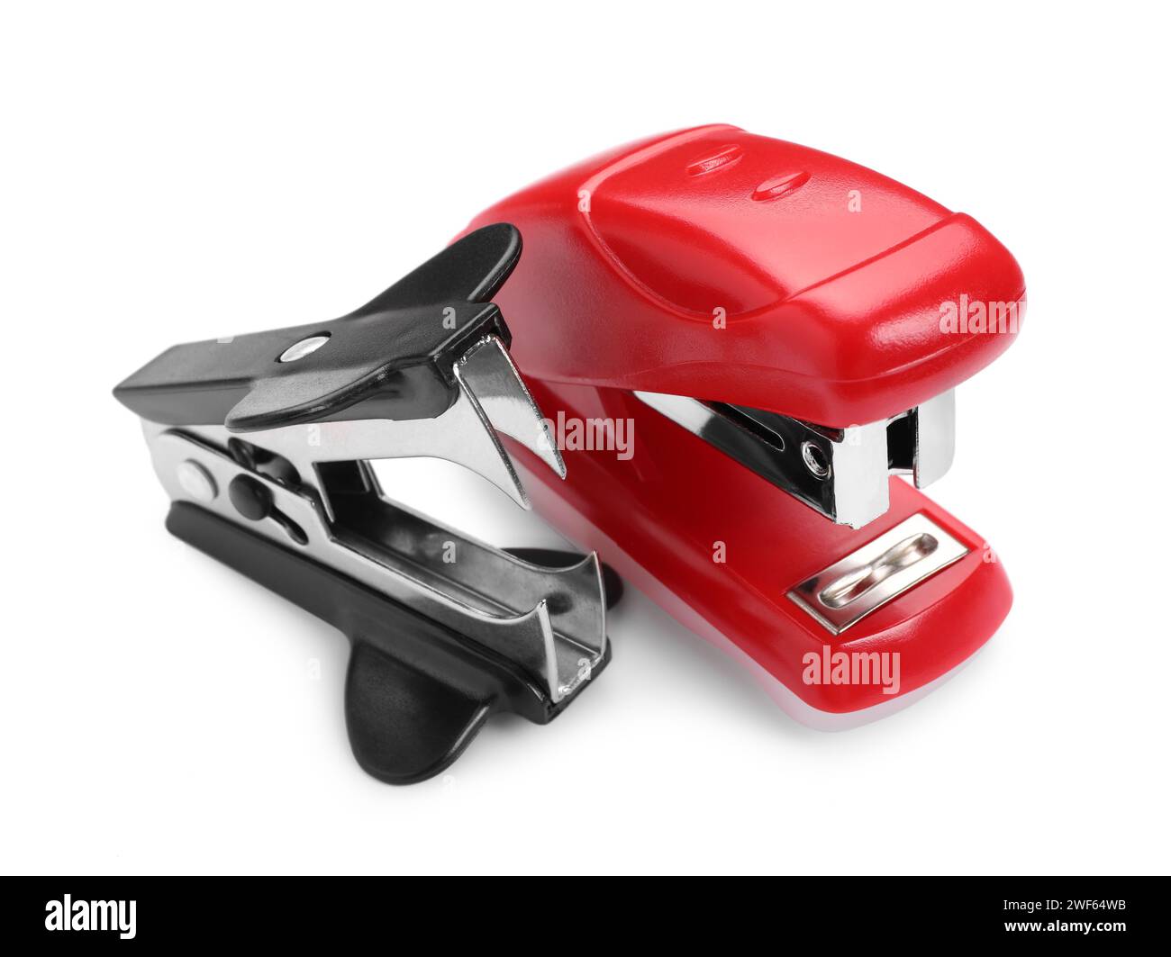 New bright stapler and staple remover isolated on white, closeup Stock ...