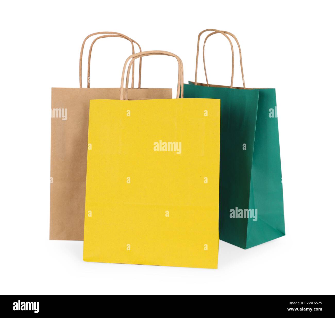 Three paper shopping bags on white background Stock Photo - Alamy
