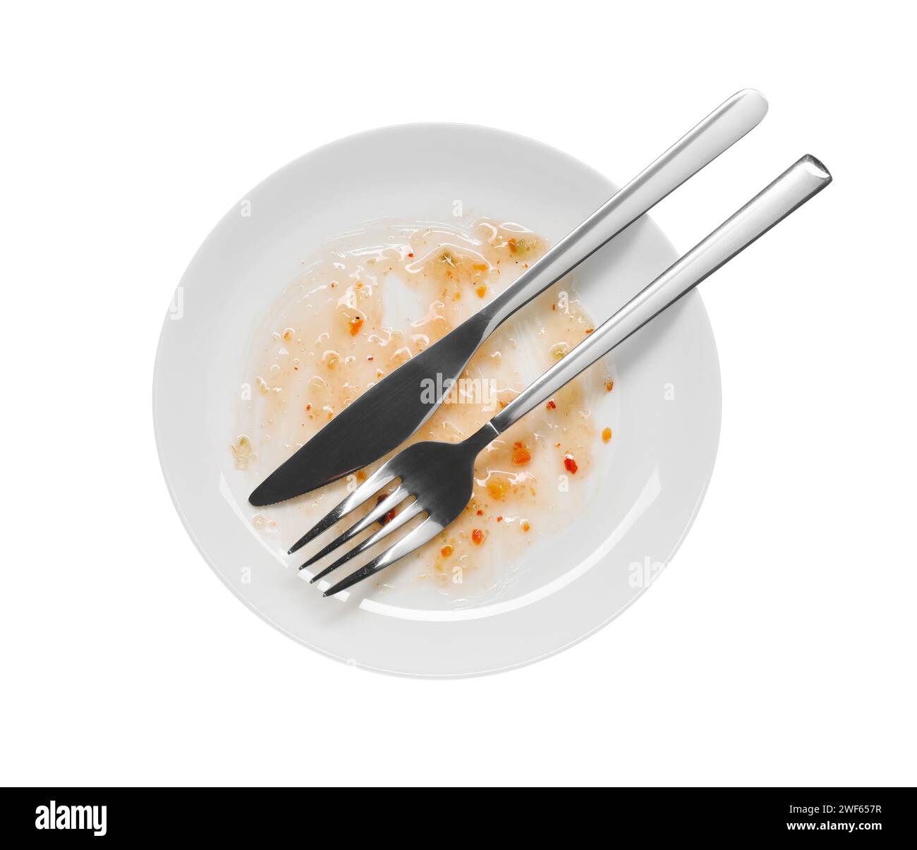 Dirty plate and cutlery on white background, top view Stock Photo - Alamy
