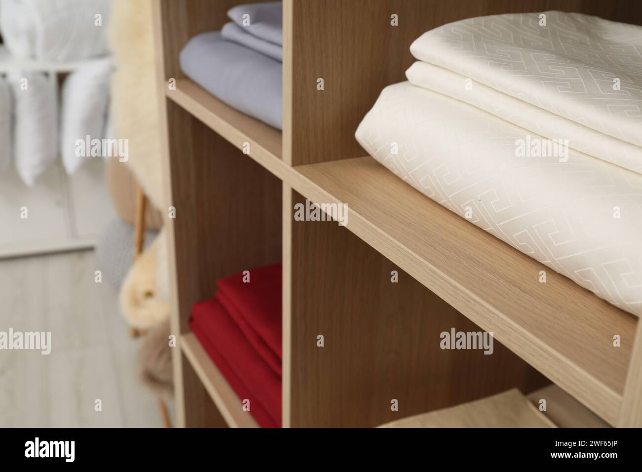 Different colorful bed linens on display in home textiles store Stock ...