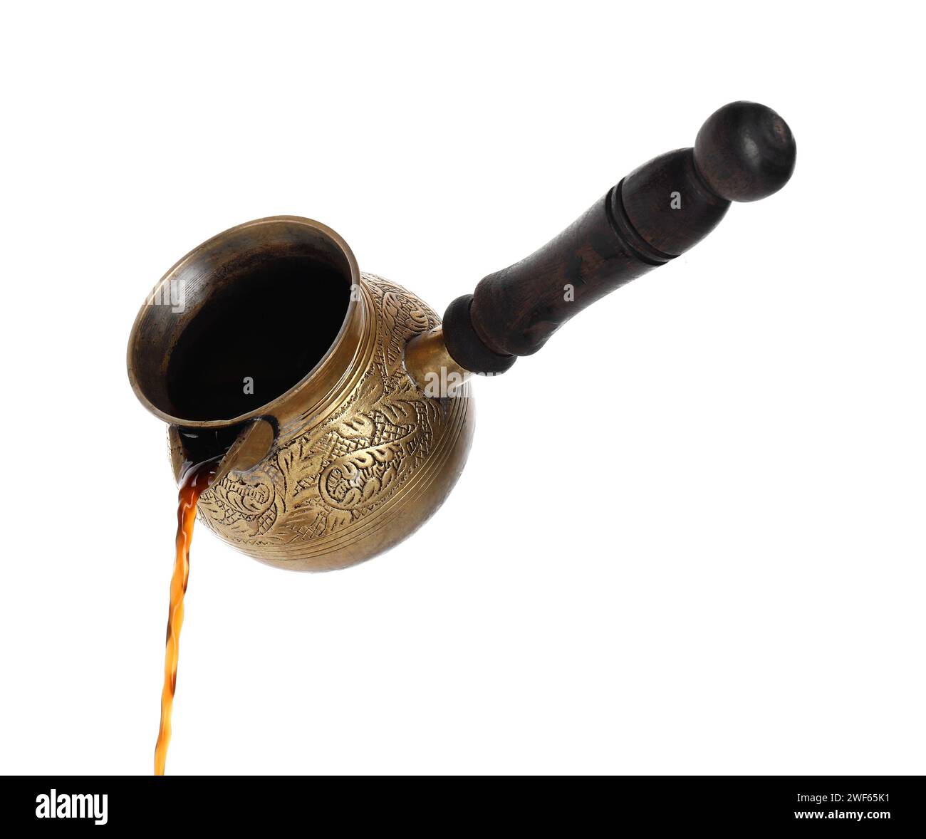 Turkish coffee. Pouring brewed beverage from cezve on white background ...